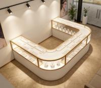 China Luxury U-Shaped Aluminium Jewelry Display Cabinet | Cream Color Gold Metal Frame | Modular Island Counter Retail Store Mall for sale