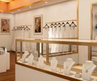 China Luxury U-Shaped Aluminium Jewelry Display Cabinet | Cream Color Gold Metal Frame | Modular Island Counter Retail Store Mall for sale