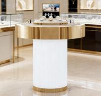 China High-End Gold Finish Round Watch Display Counter with LED Illuminated Base Jewelry Showcase Built-in Screen for Retail for sale