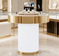 China High-End Gold Finish Round Watch Display Counter with LED Illuminated Base Jewelry Showcase Built-in Screen for Retail for sale