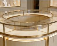 China Luxury Jewelry Display Cabinet for Mall Retail Store | Cream Solid Wood Gold Metal Frame | Built-in LED Lights Circular Design for sale