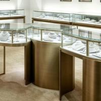 China Professional Jewelry Showcase Cabinet Wood Finish Wide Counter Boutique Store Retail Sales Area Lighting for sale