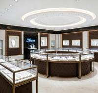 China High-End Luxury Jewelry Island Kiosk, Custom Bronze Frame & Tufted Leather Tempered Glass Showcase for Luxury Jewelry Store for sale