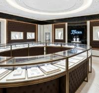 China High-End Luxury Jewelry Island Kiosk, Custom Bronze Frame & Tufted Leather Tempered Glass Showcase for Luxury Jewelry Store for sale