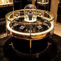 China Luxurious Round Gold High-end Jewelry Display Case, a Lavish Central Display Cabinet Featuring LED Lighting and a Glass Top for sale