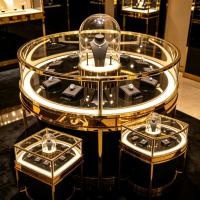 China Luxurious Round Gold High-end Jewelry Display Case, a Lavish Central Display Cabinet Featuring LED Lighting and a Glass Top for sale