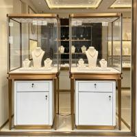 China Affordable Luxury Rose Gold Freestanding Jewelry Display Cabinet |Glass Display Case with Lockable Drawers Jewelry Display Stand for sale
