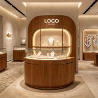 China Curved Wooden Jewelry Island Counter with Glass Jewelry Display Cabinets Featuring Storage Doors and LED Lighting for sale