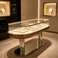 China Metal Oval Jewelry Island Display  High-End Luxury Jewelry Display Stand  Curved Glass Jewelry Display Case with LED Lighting for sale