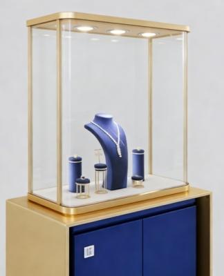 China Luxury Blue Gold Jewelry Showcase Custom Stainless Steel Glass Pedestal Cabinet LED Light Necklace Ring Retail Store Mall for sale