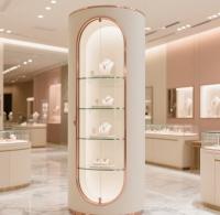 China Cylindrical Arched Tall High Quality Jewelry Display Cabinet | Cream Body Rose Gold Trim | Glass Showcase LED Mall Retail Stores for sale