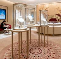 China Luxury Cylindrical Jewelry Display Pedestal | Cream Gold Metal Frame | Tall Glass Showcase Built-in LED Spotlights Showroom Use for sale