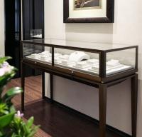 China Vintage Luxury Tall Jewelry Display Case LED Lighting Bronze Frame Glass Pedestal Showcase for Necklace Pendant Showroom Use for sale