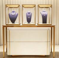 China Modern Round Glass Jewelry Display Table with Gold Trim and LED Lighting Luxury Mall Showcase for Rings & Bracelets for sale