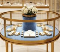 China Modern Round Glass Jewelry Display Table with Gold Trim and LED Lighting Luxury Mall Showcase for Rings & Bracelets for sale