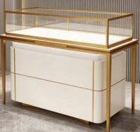 China Modern Round Glass Jewelry Display Table with Gold Trim and LED Lighting Luxury Mall Showcase for Rings & Bracelets for sale