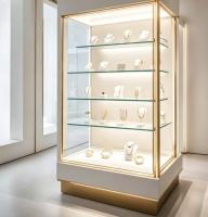 China Luxury Vertical Fluted Red Velvet Gold Jewelry Display Cabinet, Premium Glass Showcase for High-End Gold Retail for sale