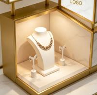 China Custom Luxury Jewelry Store Gold Frame Marble LOGO Vertical Display Cabinet, Glass Showcase for sale