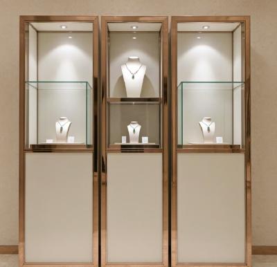 China Luxury Rose Gold Trim Jewelry Display Cabinet, Tall Glass Showcase with LED Lighting for High-End Jewelry for sale