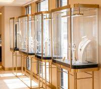 China Luxury Freestanding Gold Jewelry Display Cabinet LED Lighting Customizable Design for Commercial Jewelry Store Displays Malls for sale