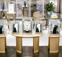 China Luxury Jewelry Display Cabinets with LED Lighting Curved Island & Customizable Design for Boutique and Luxury Shopping Malls for sale