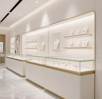 China Wall-Mounted High Quality Jewelry Display Counter for Retail Store Mall | Cream Body Brushed Gold Trim | Glass Showcase LED for sale