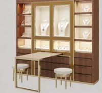 China Luxury LED Lit Wall Mounted Jewelry Display Cabinet with Wood & Gold Metal Frame Glass Showcase and Storage Drawers for sale