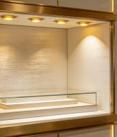 China Luxury Modern Multi-Layer Tall Jewelry Display Case with Gold Frame and LED Lighting for Luxury Shopping Malls for sale