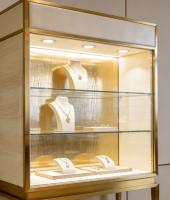China Luxury Modern Multi-Layer Tall Jewelry Display Case with Gold Frame and LED Lighting for Luxury Shopping Malls for sale
