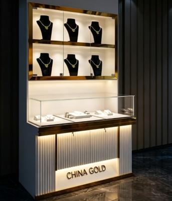 China Commercial Jewelry Display Stand Multi-Layer Glass Door Stainless Steel Brass Wood Construction LED Lighting Retail Store for sale