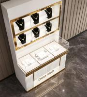 China Commercial Jewelry Display Stand Multi-Layer Glass Door Stainless Steel Brass Wood Construction LED Lighting Retail Store for sale