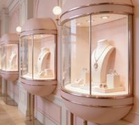 China Elegant Curved Wall-Mounted Jewelry Display Cabinet Acrylic Dome Glass Showcase LED Lighting Pink Rose Gold Frame for Showroom for sale