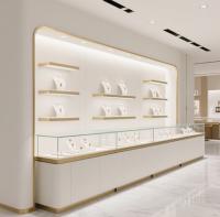 China Wall-Mounted High Quality Jewelry Display Counter for Retail Store Mall | Cream Body Brushed Gold Trim | Glass Showcase LED for sale