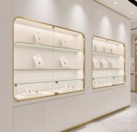 China Wall-Mounted High Quality Jewelry Display Counter for Retail Store Mall | Cream Body Brushed Gold Trim | Glass Showcase LED for sale