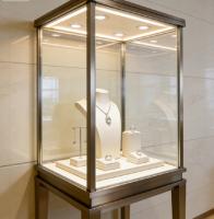 China Custom Jewelry Display Counter Premium Brushed Stainless Steel Tempered Glass Showcase LED Lighting Durable Luxury Watch for sale