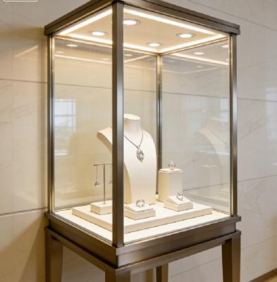 China Custom Jewelry Display Counter Premium Brushed Stainless Steel Tempered Glass Showcase LED Lighting Durable Luxury Watch for sale