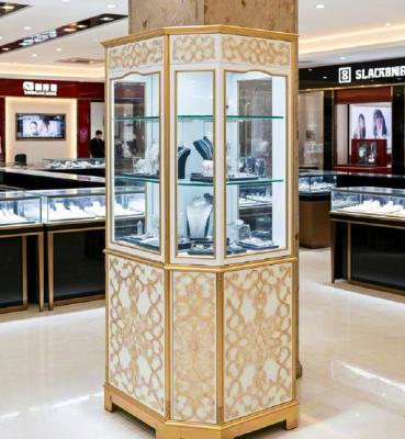 China Luxury European Hexagonal Jewelry Display Cabinet Tempered Glass LED Lighting | White Gold Carved Design | Customizable Malls for sale