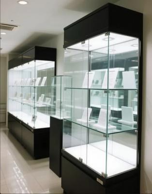 China Retail Wall Jewelry Showcase Metal Structure Wooden Back Panel Glass Display Cabinet for sale