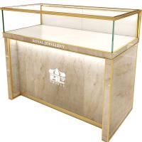 China Stone Veneer Jewellery Display Table Gold Metal Frame LED Light Glass Top Rectangular Jewelry Showcase Counter Display Case for sale