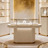 China Modern Oval Glass Jewelry Display Case with Grooved Base and LED-Lit Curved Surface Display Showcase for sale