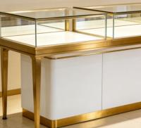 China Luxury Gold Frame Glass Jewelry Display Case with White Leather Base LED Lighting for Retail Stores & Luxury Malls for sale