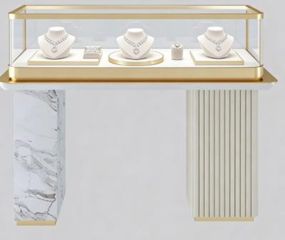 China Luxury Modern Multi-Layer Tall Jewelry Display Showcase with Gold Frame and LED Lighting Customized for Luxury Shopping Malls for sale