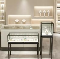 China Custom Jewelry Display Showcase Big Mall Brand Shop LED Lighting Paint Wood Glass Black Gold Commercial Display for sale
