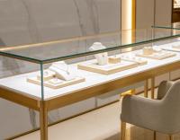 China Luxury Rectangular Jewelry Display Table Gold Frame Tempered Glass Showcase LED Lit Marble Top Jewelry Counter for Mall for sale