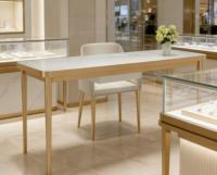 China Luxury Rectangular Jewelry Display Table Gold Frame Tempered Glass Showcase LED Lit Marble Top Jewelry Counter for Mall for sale