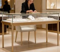 China Luxury Rectangular Jewelry Display Table Gold Frame Tempered Glass Showcase LED Lit Marble Top Jewelry Counter for Mall for sale