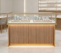 China Luxury Modern LED Jewelry Display Case Custom Wood Grain Glass Island Showcase for Diamond Ring Necklace Showroom Retail Store for sale
