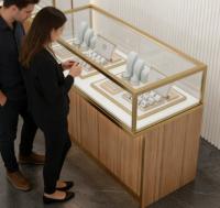 China Luxury Modern LED Jewelry Display Case Custom Wood Grain Glass Island Showcase for Diamond Ring Necklace Showroom Retail Store for sale