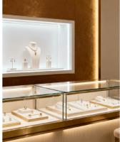 China Italian Luxury Jewelry Display Set High-End Custom Showcase with Glass Panel Gold Metal Trim LED Lighting for Luxury Retail for sale