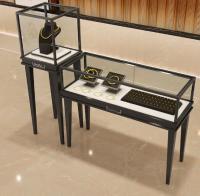 China Minimalist Luxury Jewelry Display Table Set High End Custom Showcase Glass Top Metal Frame LED Luxury Retail Premium Modern for sale